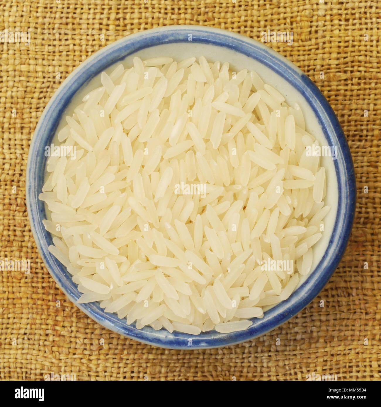 White uncooked rice Stock Photo - Alamy
