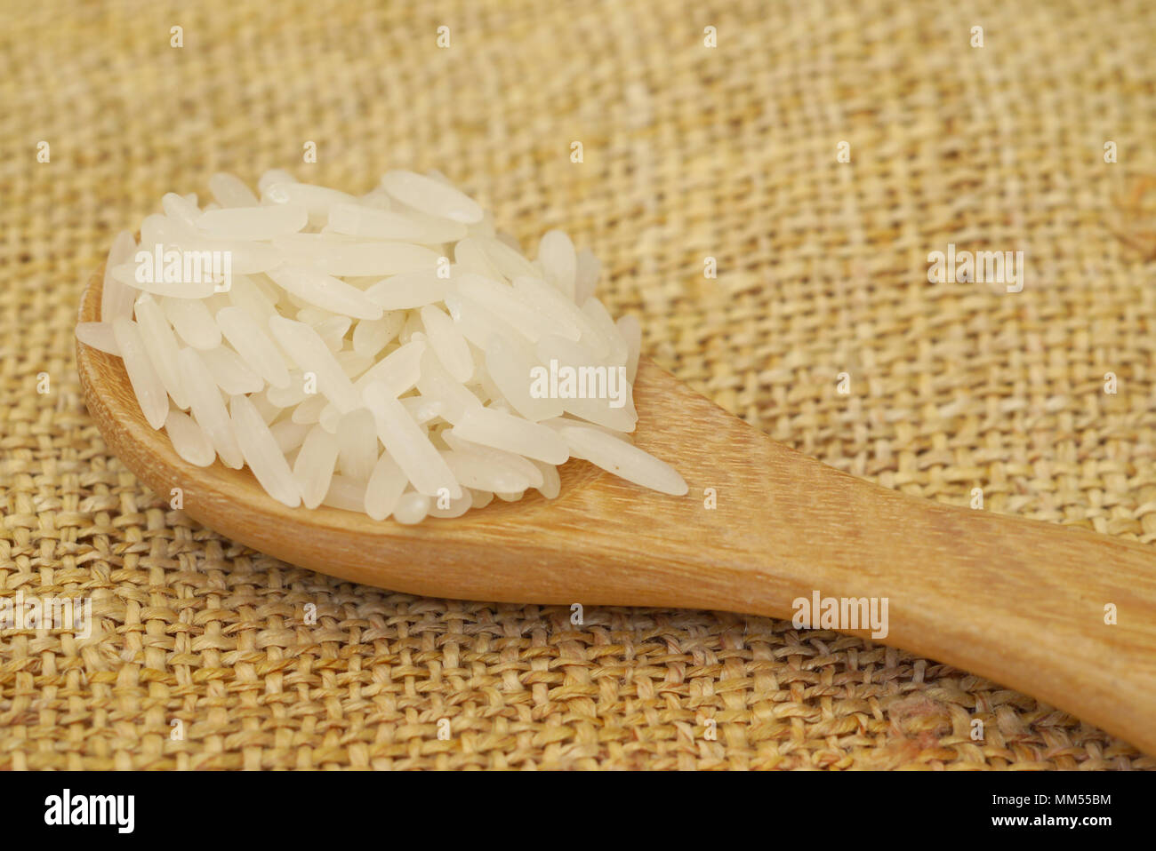 White uncooked rice Stock Photo - Alamy