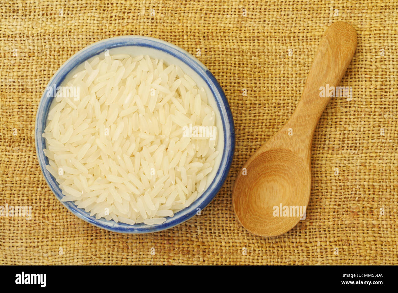 White uncooked rice Stock Photo - Alamy