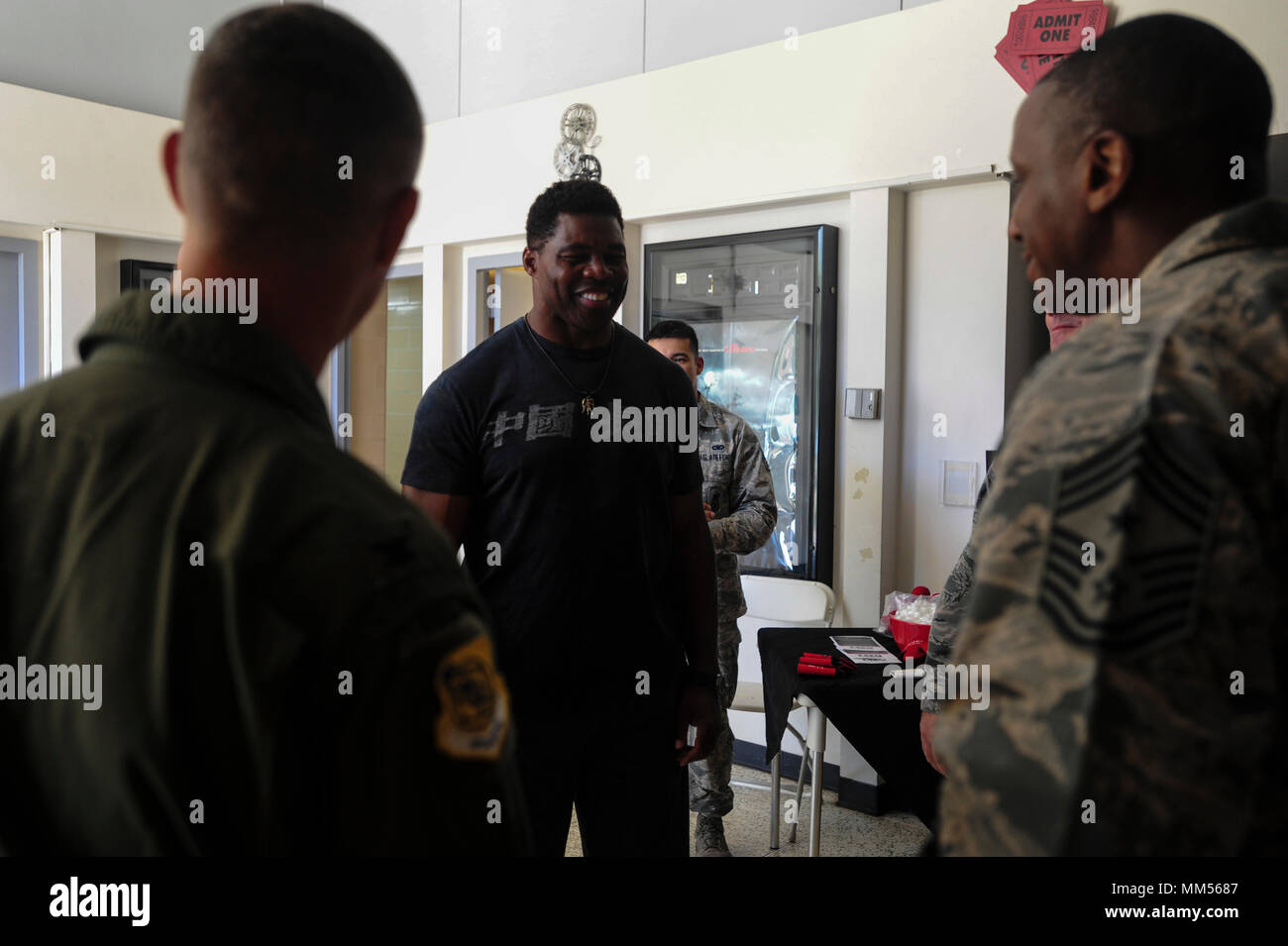 Herschel Walker, former professional football player, greets Col. Kevin ...