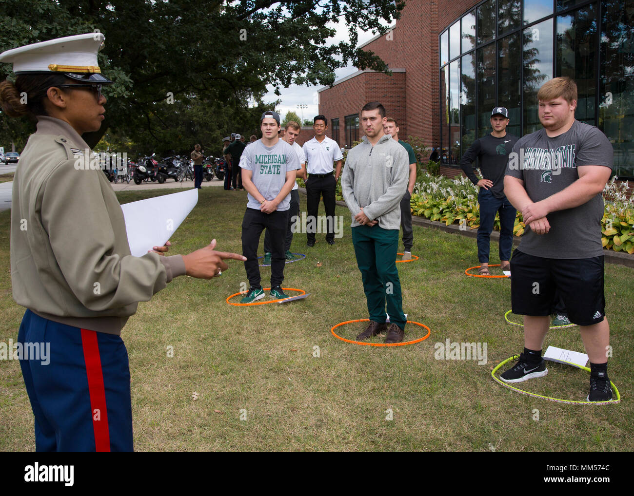 U.S. Marine Capt. Ashley McMillian, left, instructs students on team ...