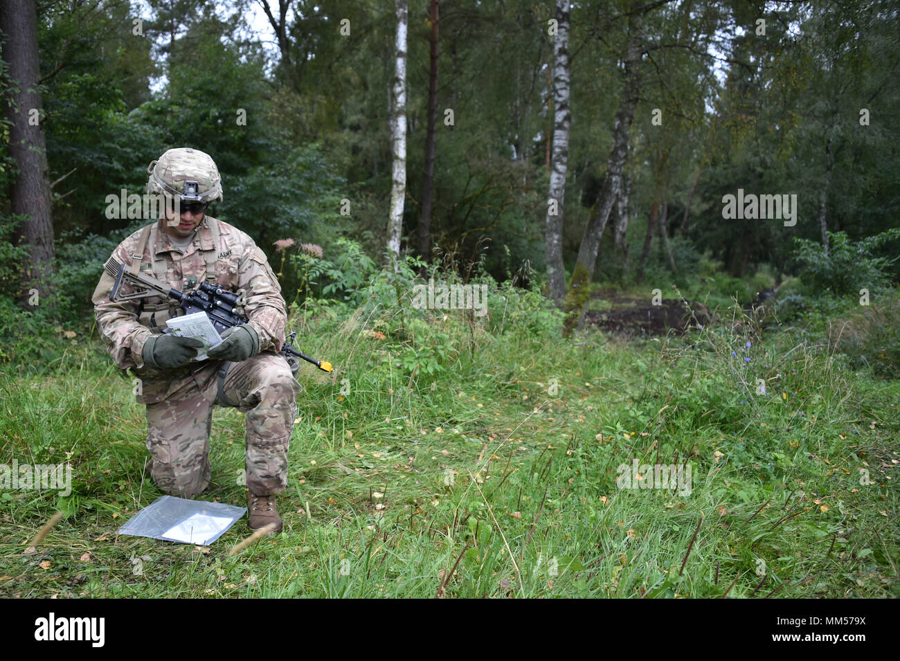 U.S. Army Staff Sgt. Nicholas Rouse, assigned to Company C, 1st ...