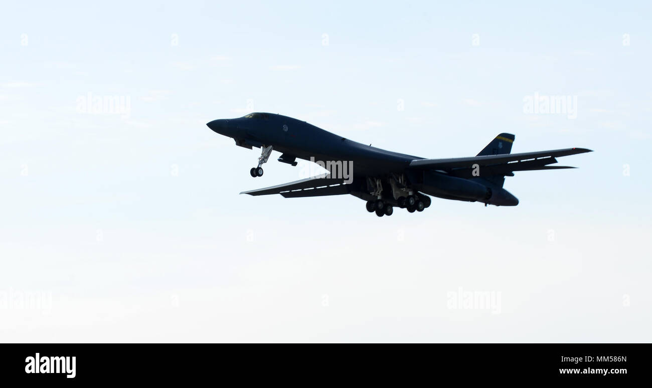 A B-1 with Col. John R. Edwards, 28th Bomb Wing Commander, and three ...