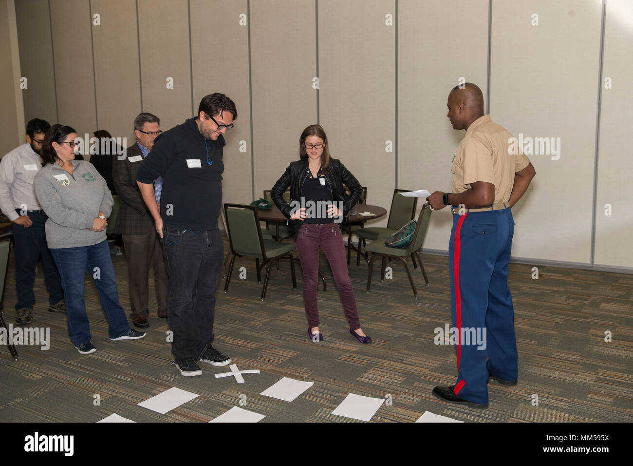 U.S. Marine Capt. Derrick E. Oliver, right, a native of New Orleans, La ...