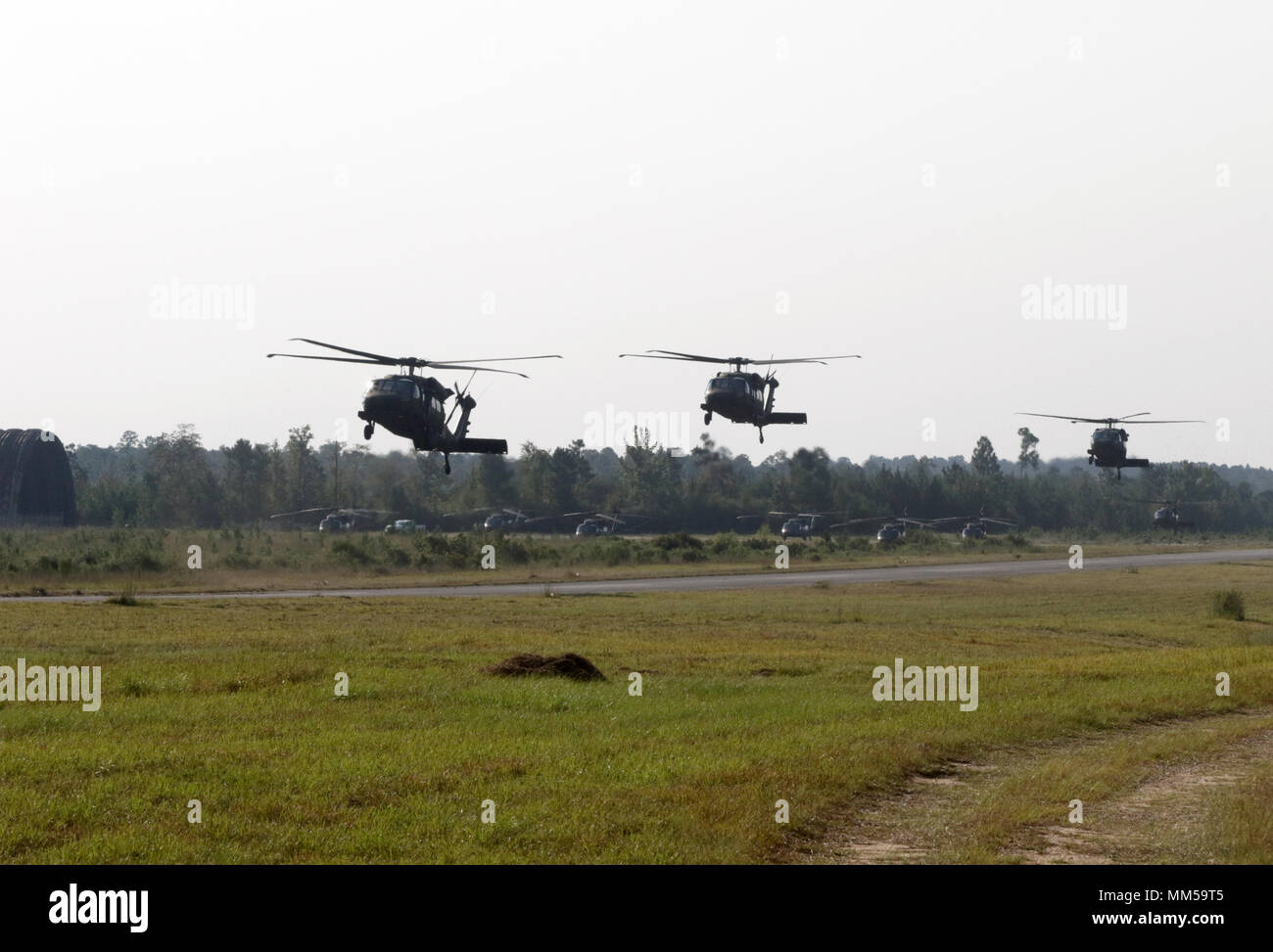 A flight of UH-60M Black Hawks descend on Camp Shelby Joint Force ...
