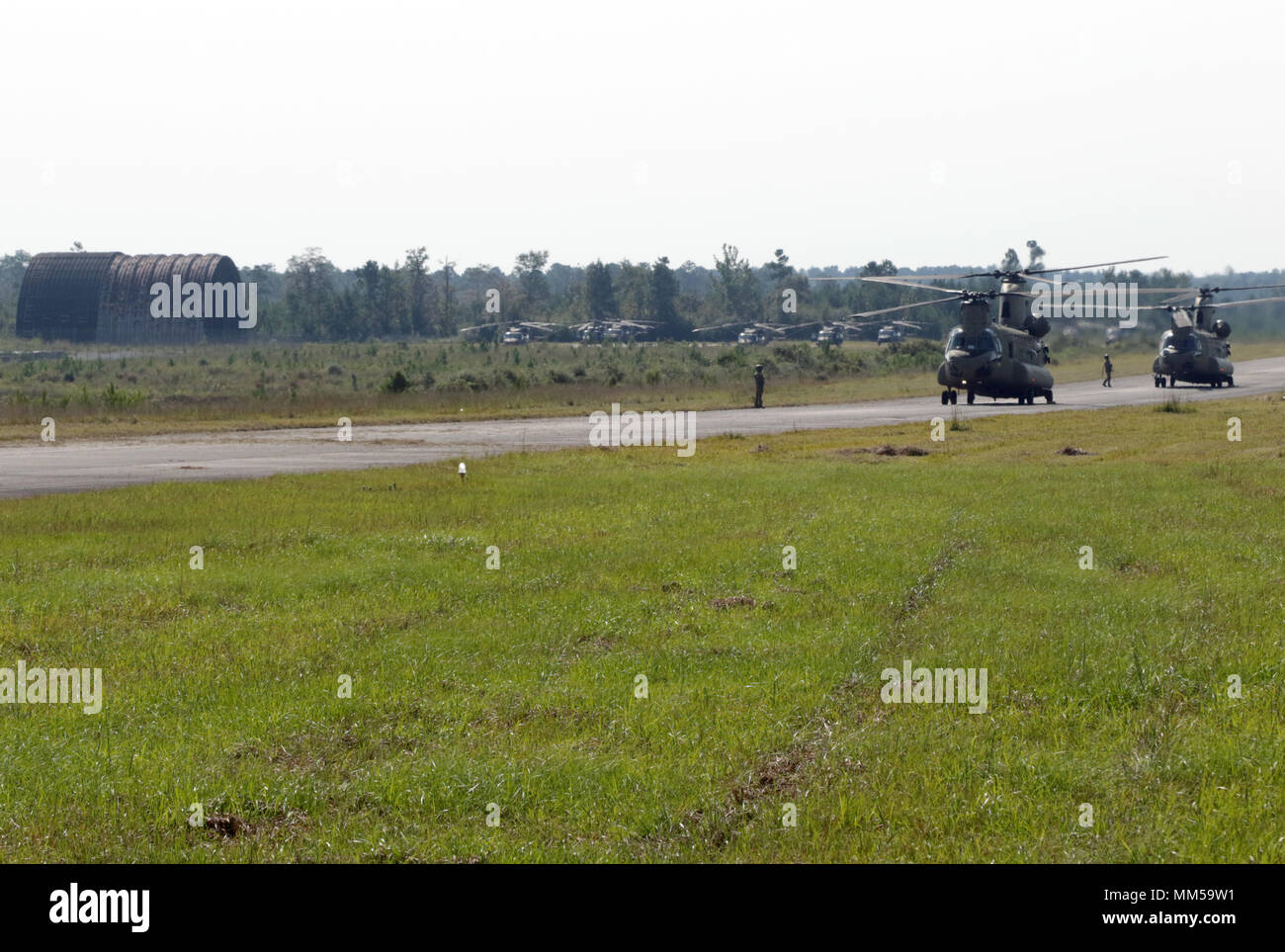 A flight of CH-47F Chinooks descend on Camp Shelby Joint Force Training ...
