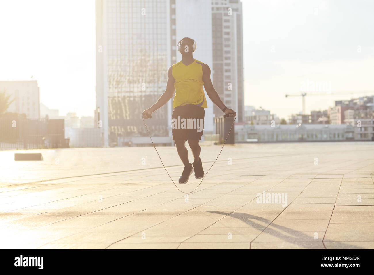 Fly. Boxer training before competitions. Holding jump rope. Outdoor ...