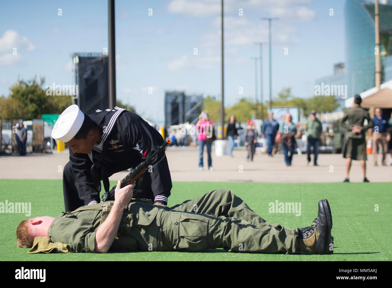 U.S. Navy Corpsman Petty Officer 3rd Class Jordan Saco performs with U ...