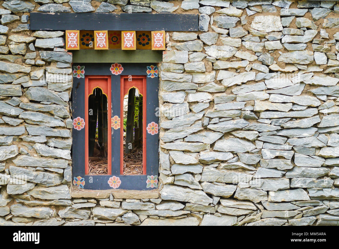 Bhutan wall style Stock Photo - Alamy
