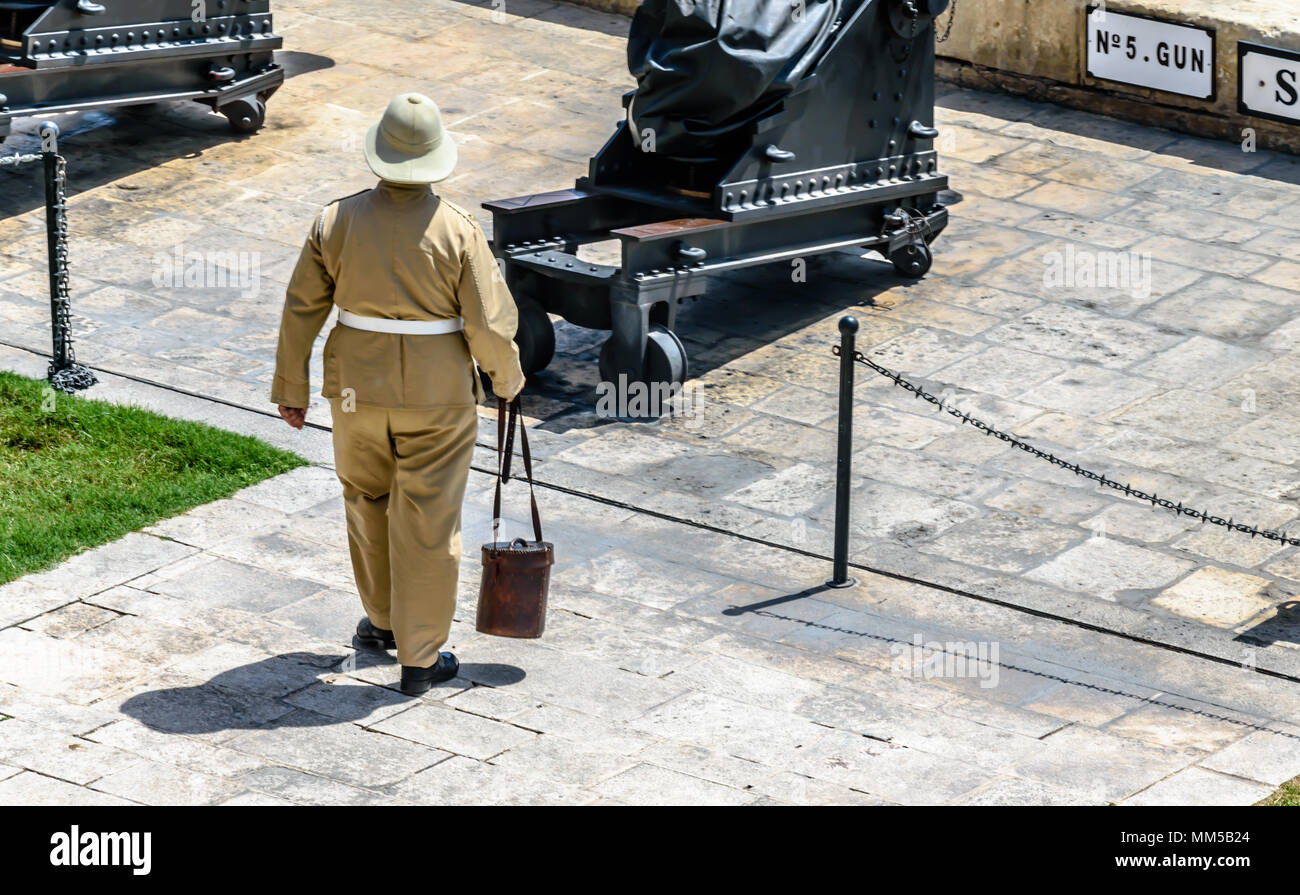 Maltese soldier prepares to fire from cannon Stock Photo - Alamy