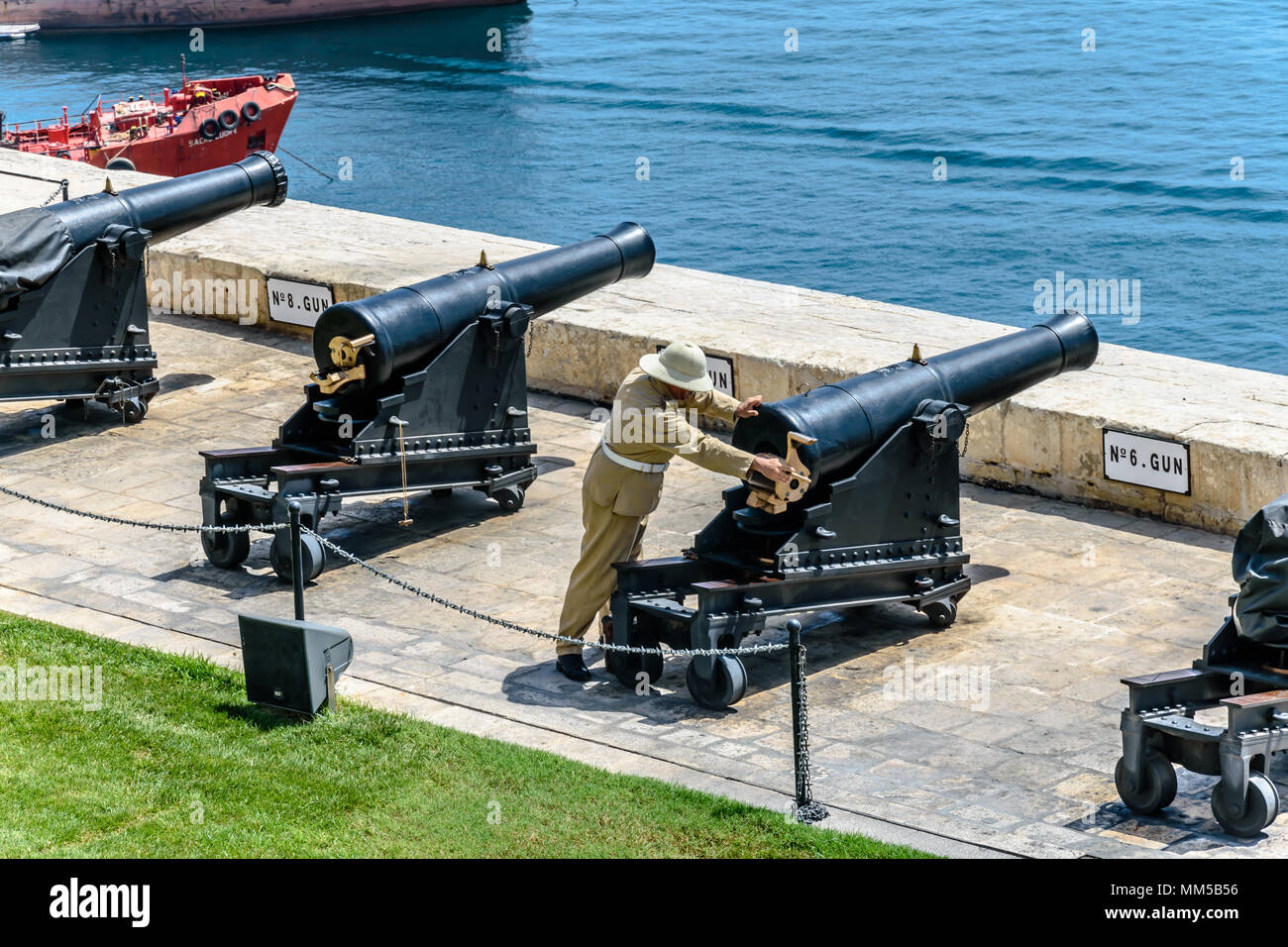 Maltese soldier prepares to fire from cannon Stock Photo - Alamy