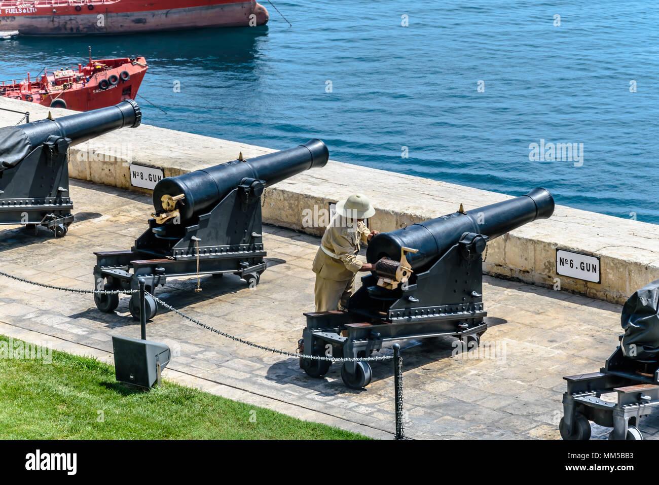 Maltese soldier prepares to fire from cannon Stock Photo - Alamy
