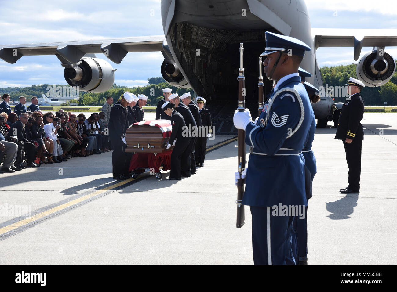 Petty Officer 1st Class Corey Ingram is returned home in a dignified ...