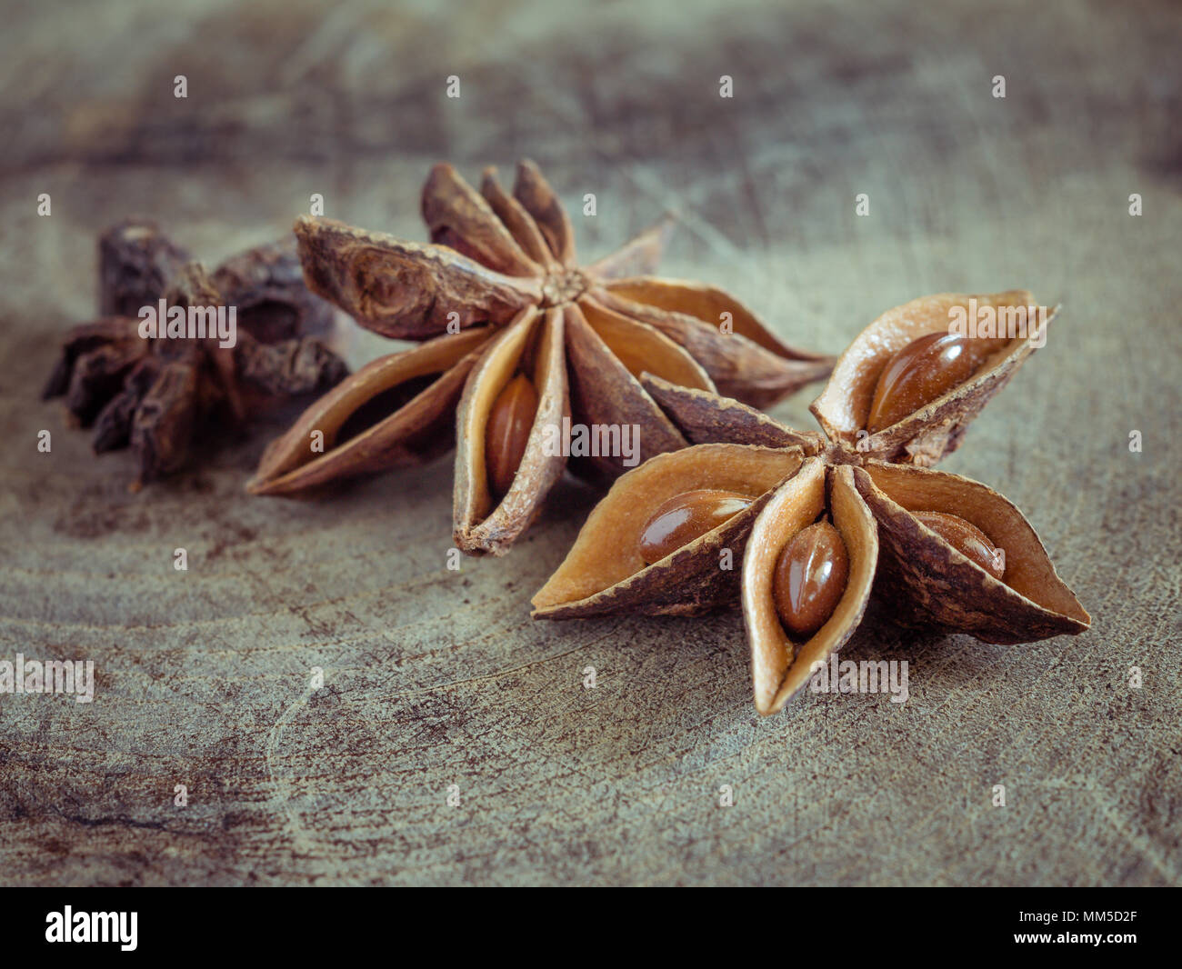 star anise on rustic wood background Stock Photo - Alamy