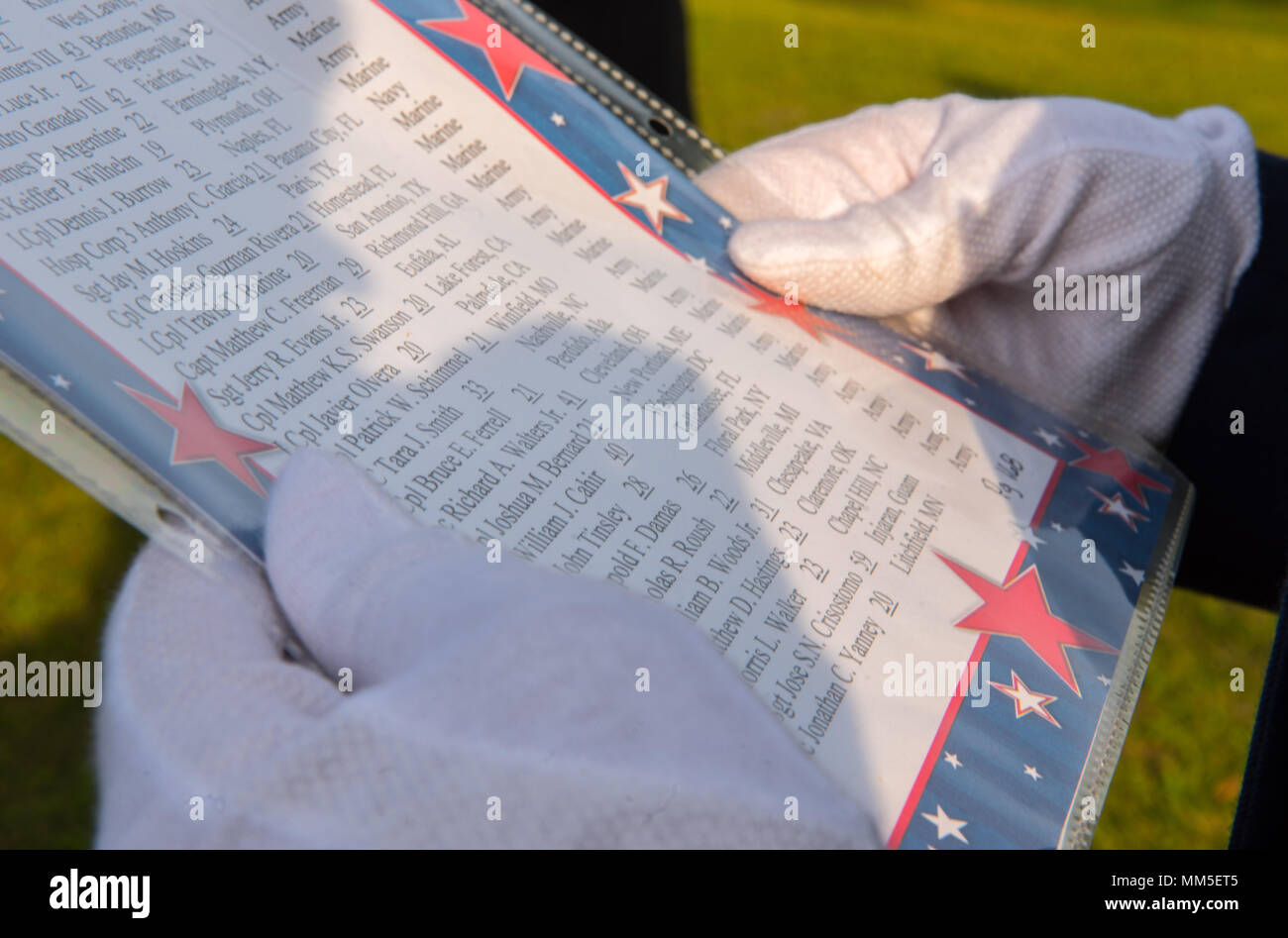 A list of names is held by a U.S. Air Force 633d Force Support Squadron ...