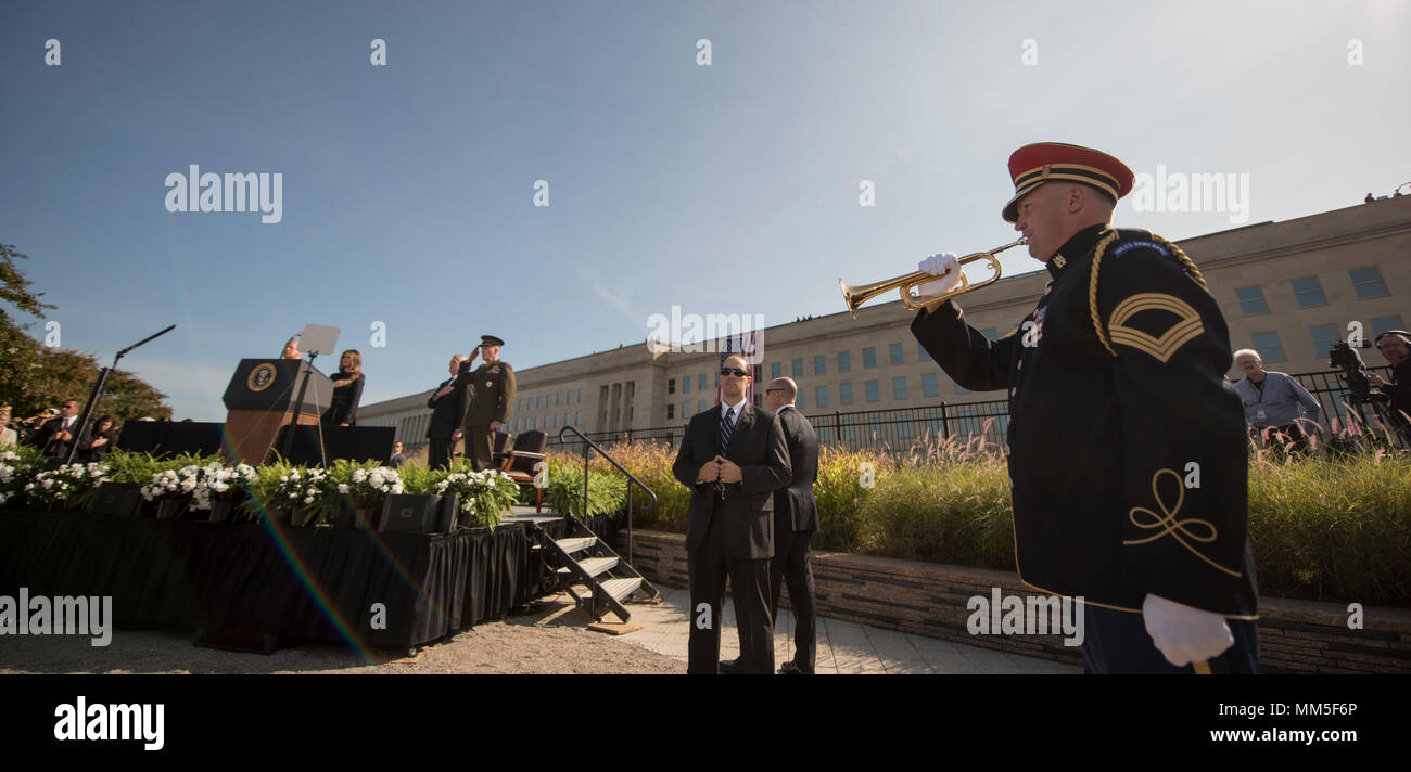 A bugler assigned to the U.S. Army Band "Pershing's Own" plays taps ...