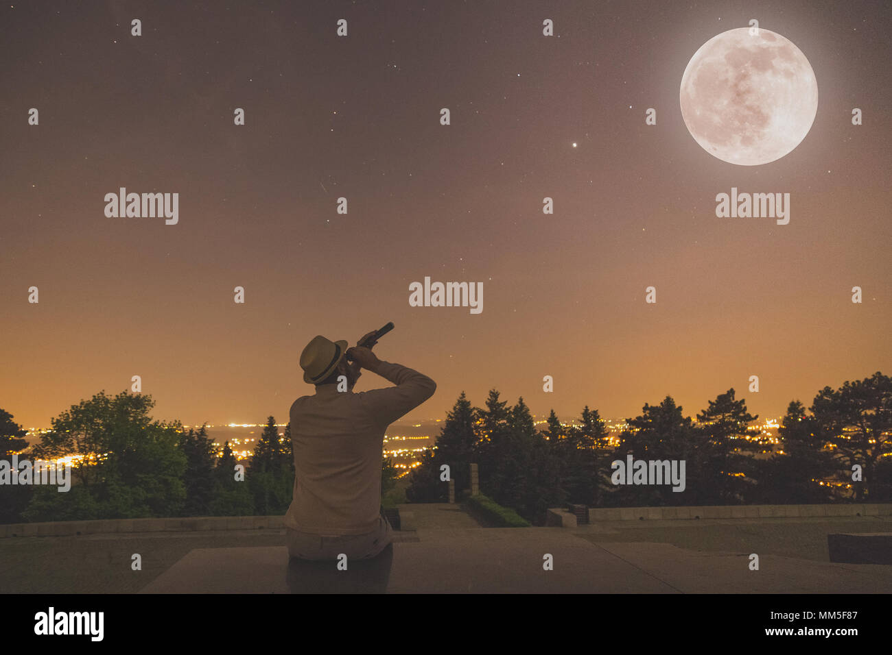 Man looking at moon spyglass hi-res stock photography and images - Alamy