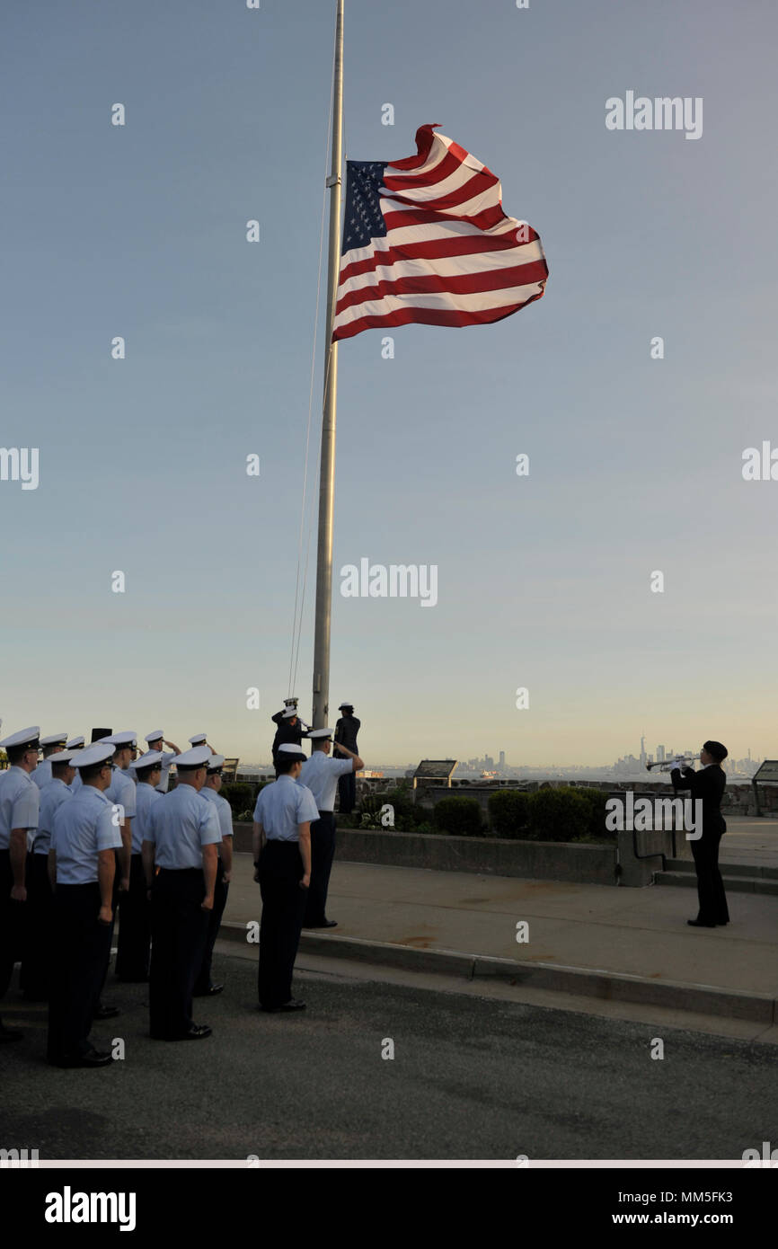 NEW YORK – A color guard from Sector New York raise the flag to half ...
