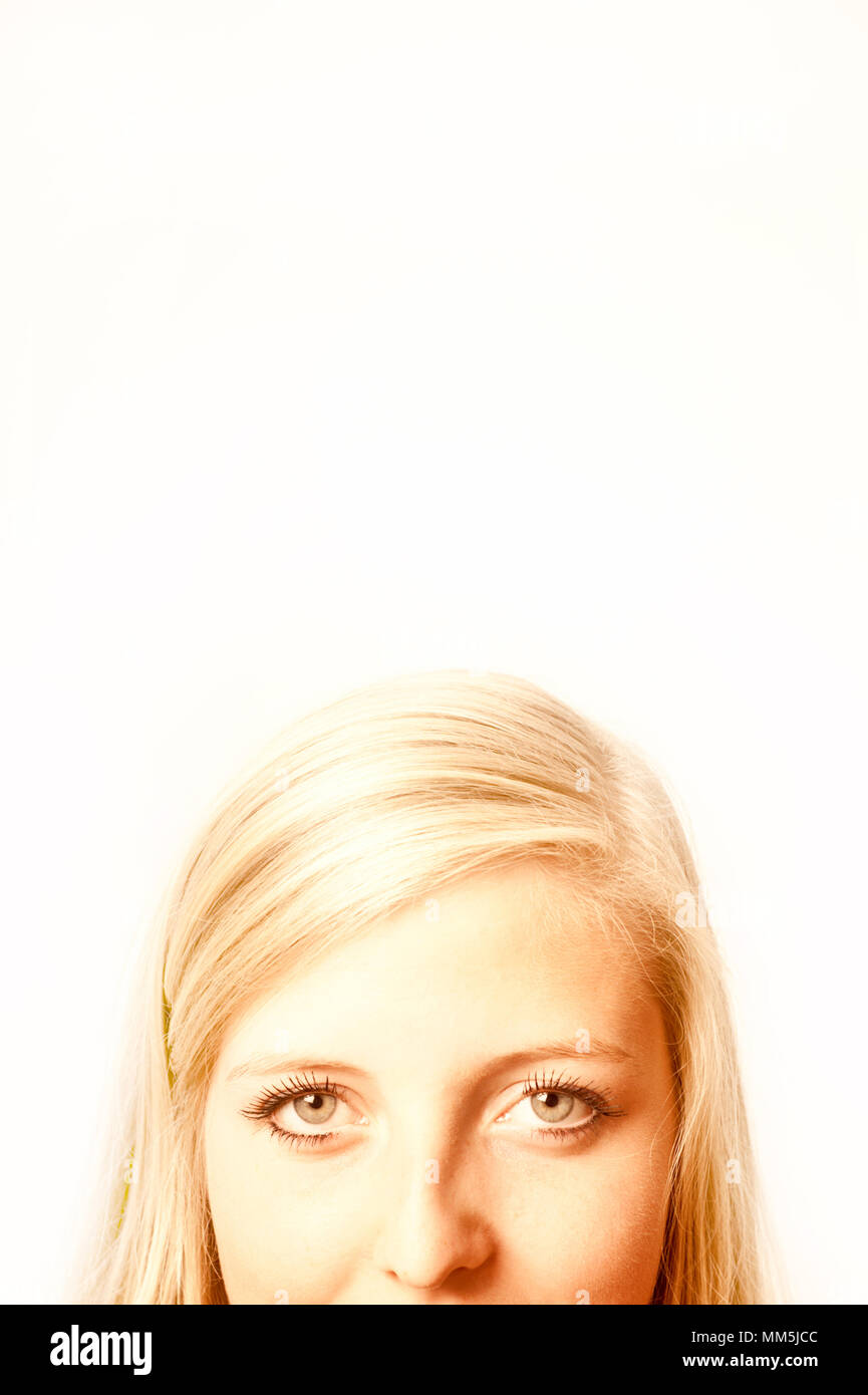 top half face of a blond young woman, just the eyes visible and copy ...