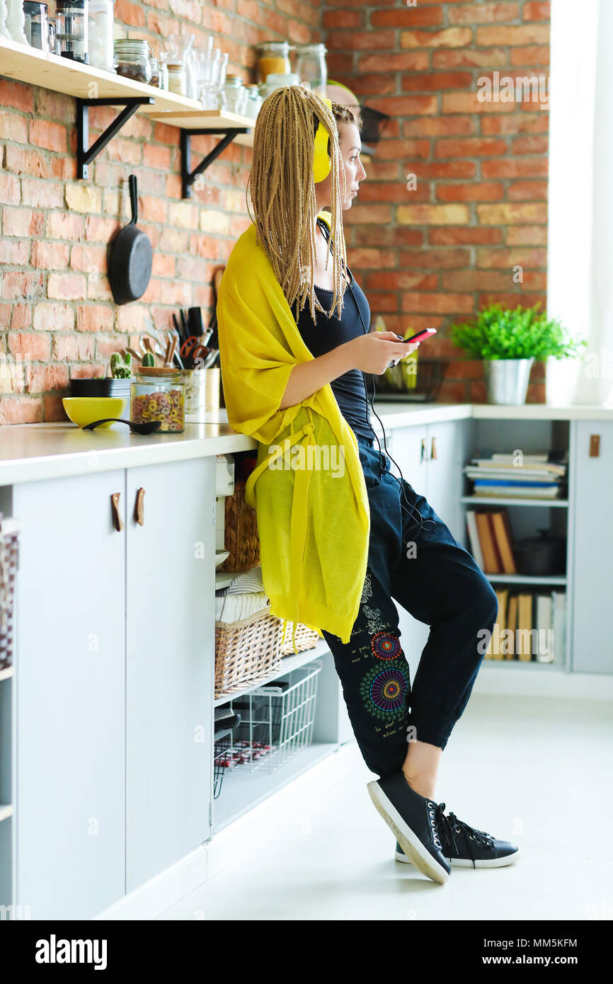 Hairstyle and fashion. Woman with yellow dreadlocks Stock Photo - Alamy
