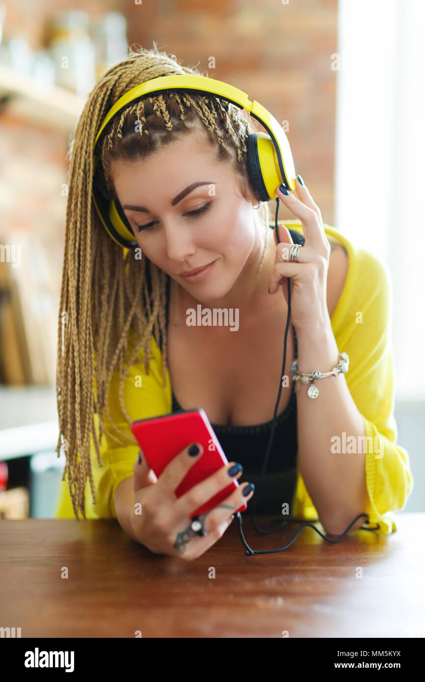 Hairstyle and fashion. Woman with yellow dreadlocks Stock Photo - Alamy