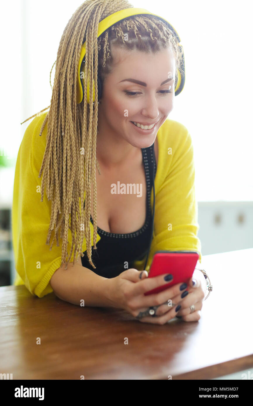 Hairstyle and fashion. Woman with yellow dreadlocks Stock Photo - Alamy