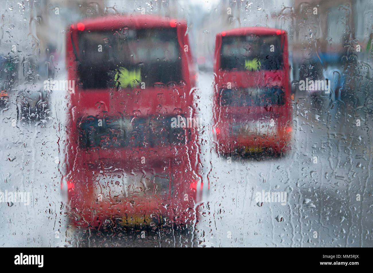 Public buses in during rainy weather, London, England Stock Photo - Alamy