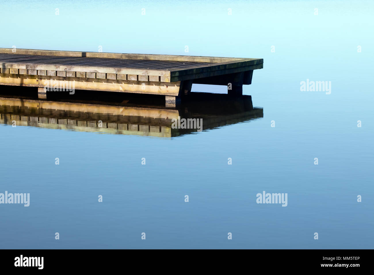 Rustic jetty on a zen-like idyllic lake in Aquitaine, France Stock ...