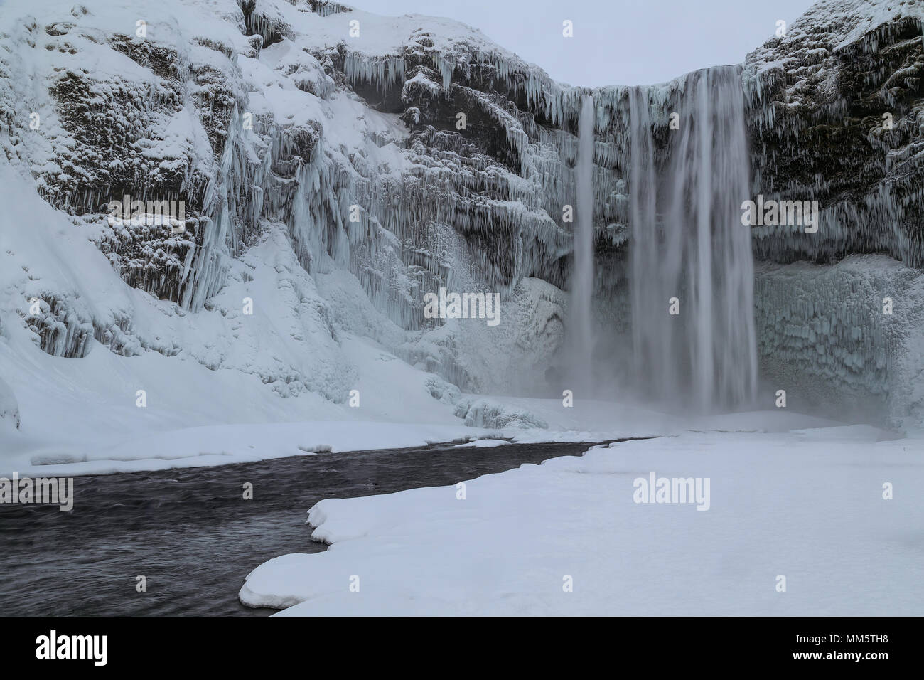 Skogafoss waterfall frozen, a treasure in Iceland Stock Photo - Alamy