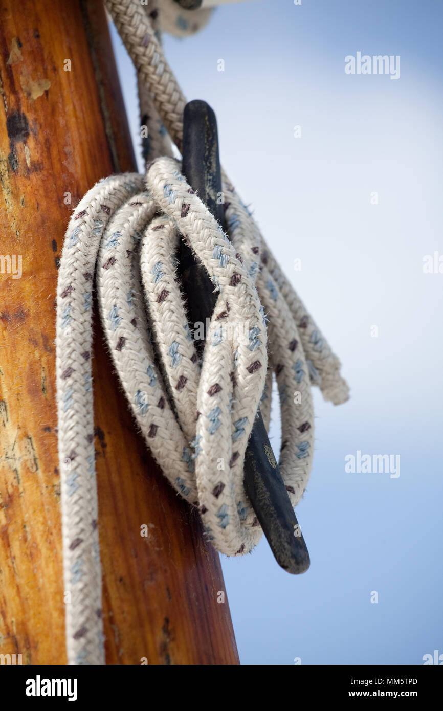 Ropes and mast details of a sailing boat against a blue sky Stock Photo ...