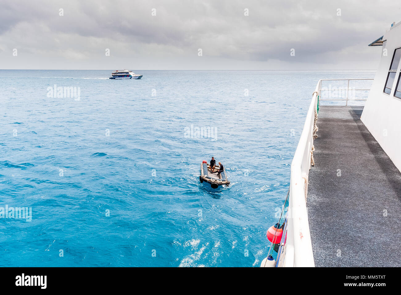 Deck hands working for scuba divers and holiday makers on board live ...