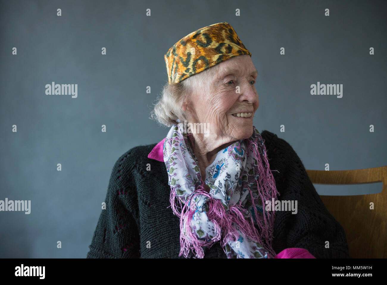 Senior woman in sweater and beret Stock Photo - Alamy