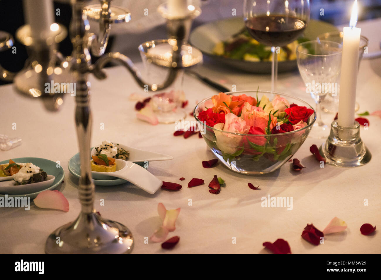 Dining table decorated for candlelight dinner Stock Photo - Alamy