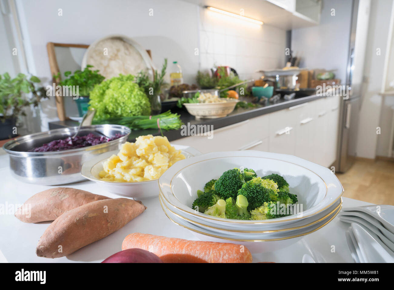 Vegetables and bowls on kitchen counter Stock Photo - Alamy