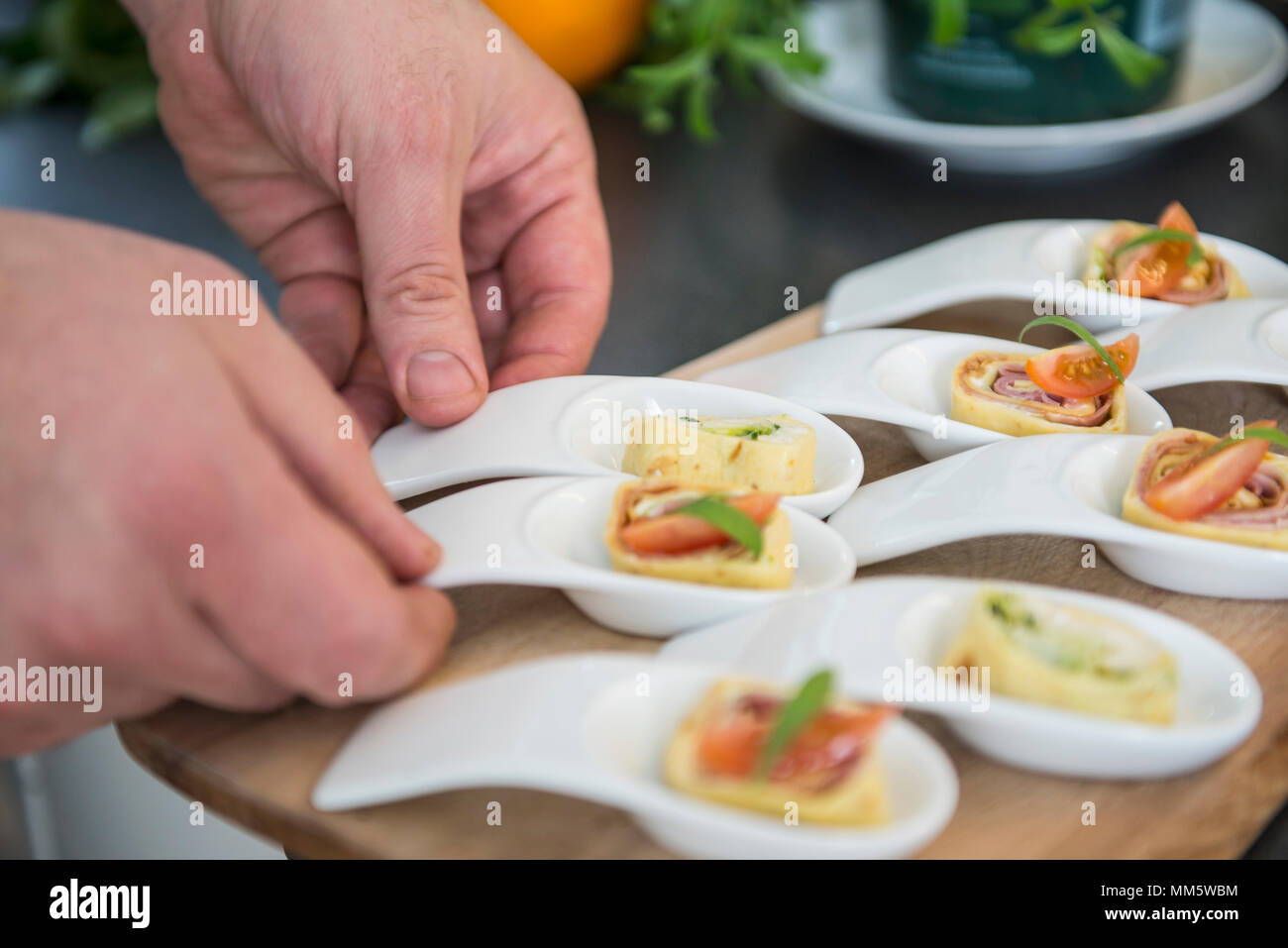 Preparing appetizers hi-res stock photography and images - Alamy