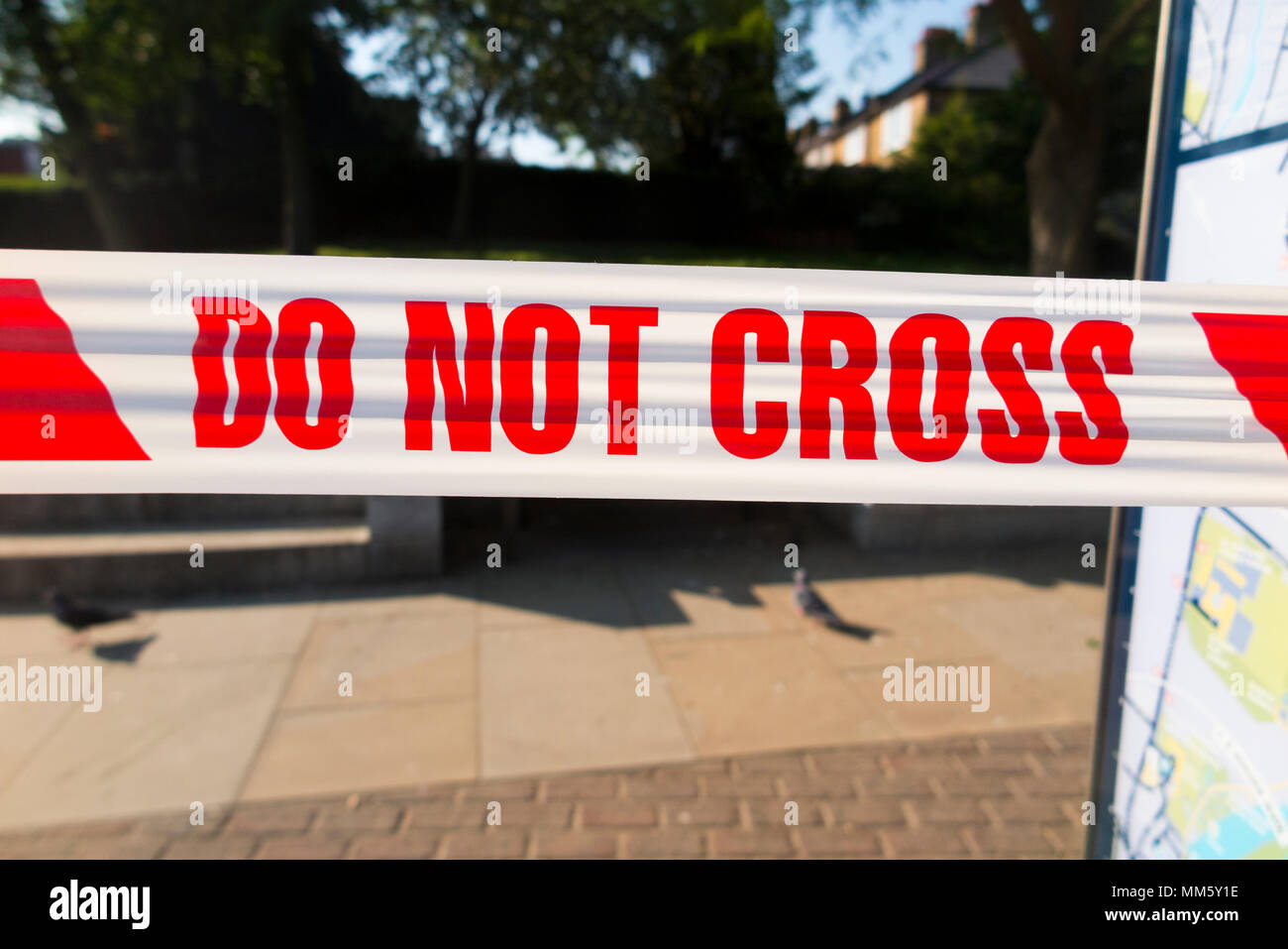 Inner cordon tape barrier placed by police or scene of crime officer ...