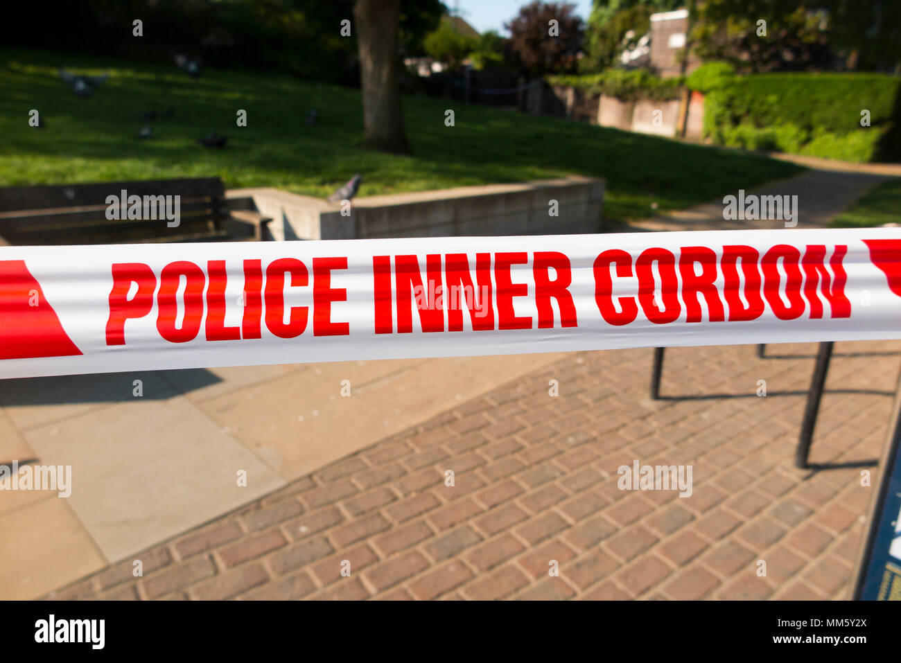 Inner cordon tape barrier placed by police or scene of crime officer ...