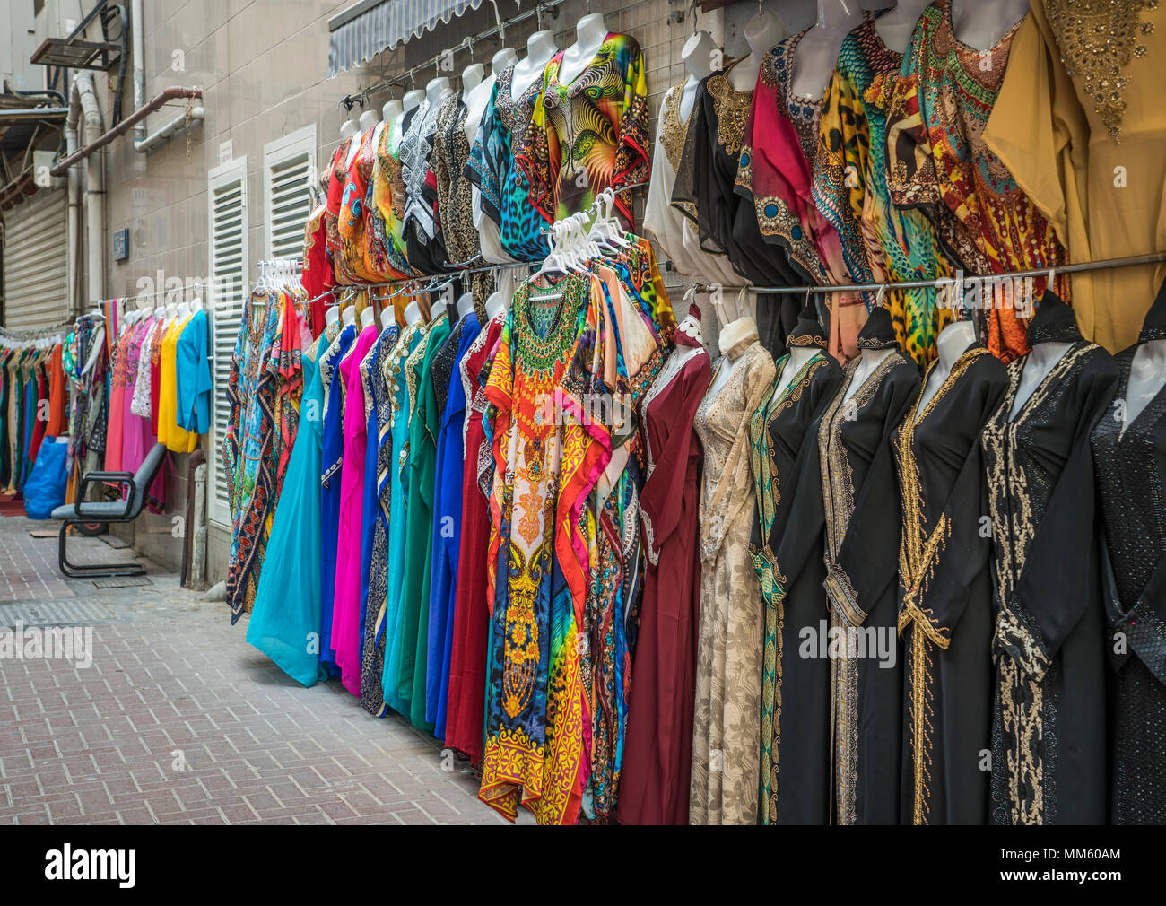 Clothes and textiles for sale in the textile markets of old town Dubai ...