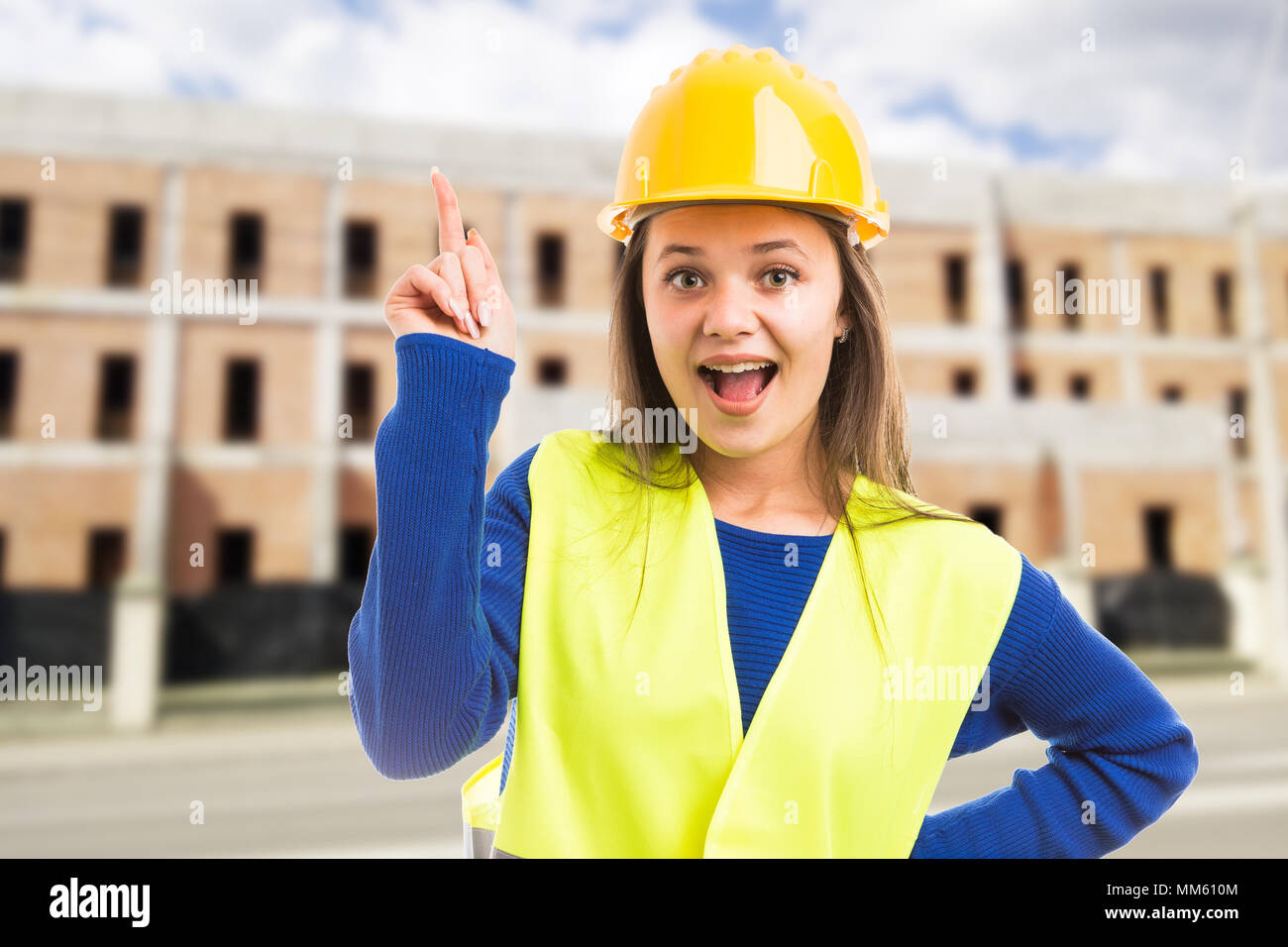 Young female engineer or architect having great idea as smart building ...