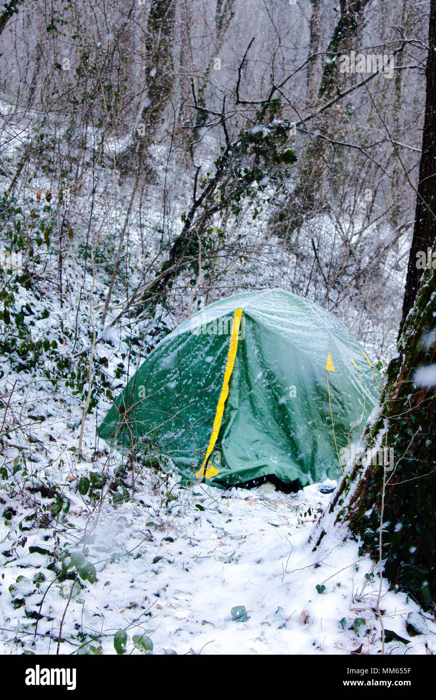 Tent is covered with snow. Unexpected cold and overnight hikers in ...