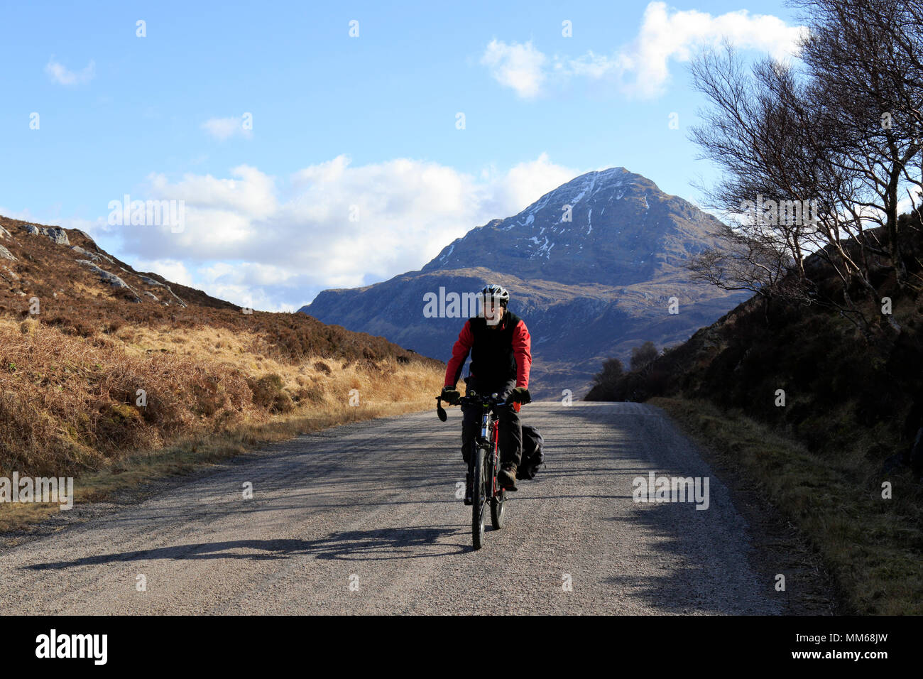 Cycling in Sutherland with Ben Stack in distance Stock Photo - Alamy