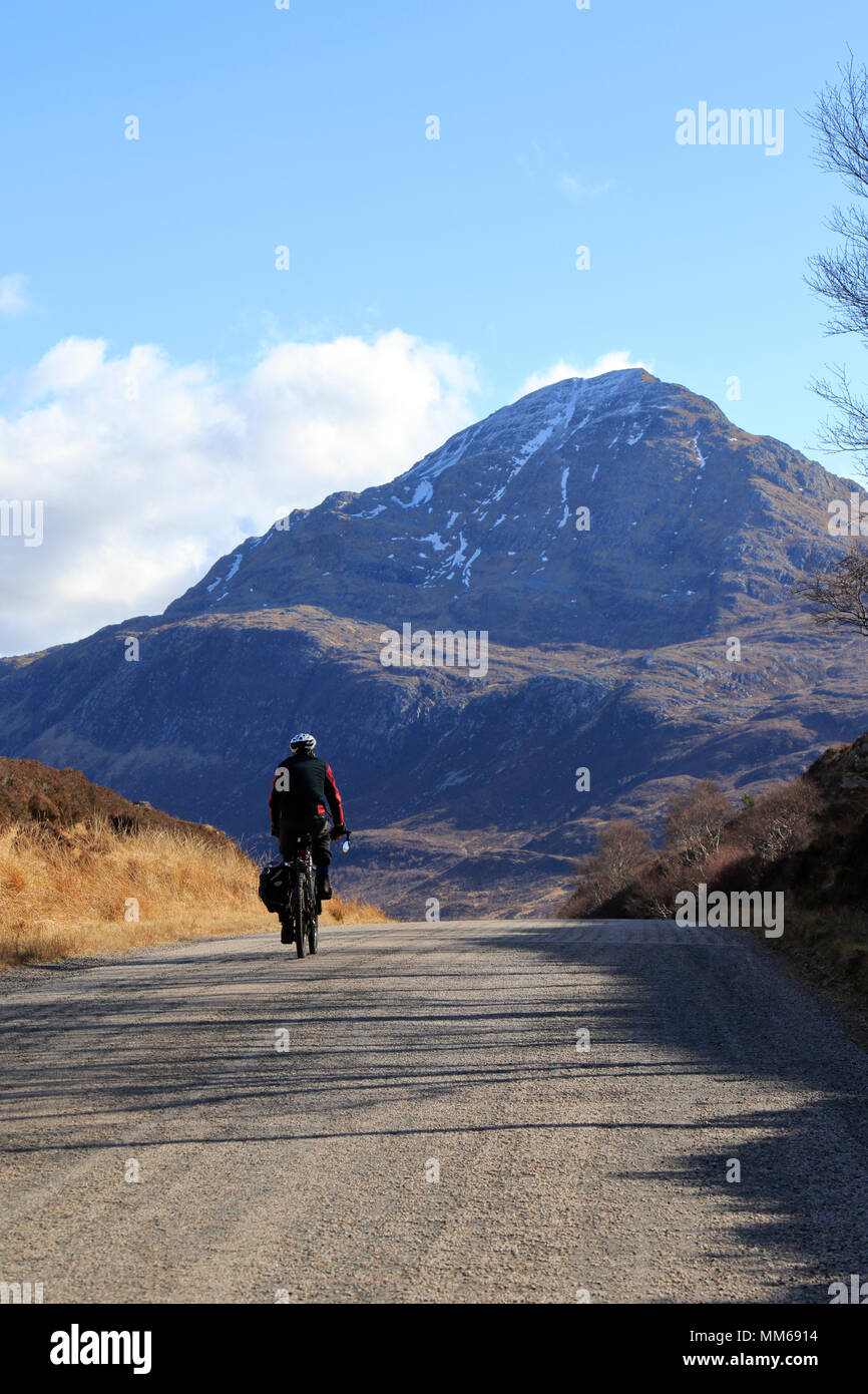 Cycling in Sutherland with Ben Stack in distance Stock Photo - Alamy