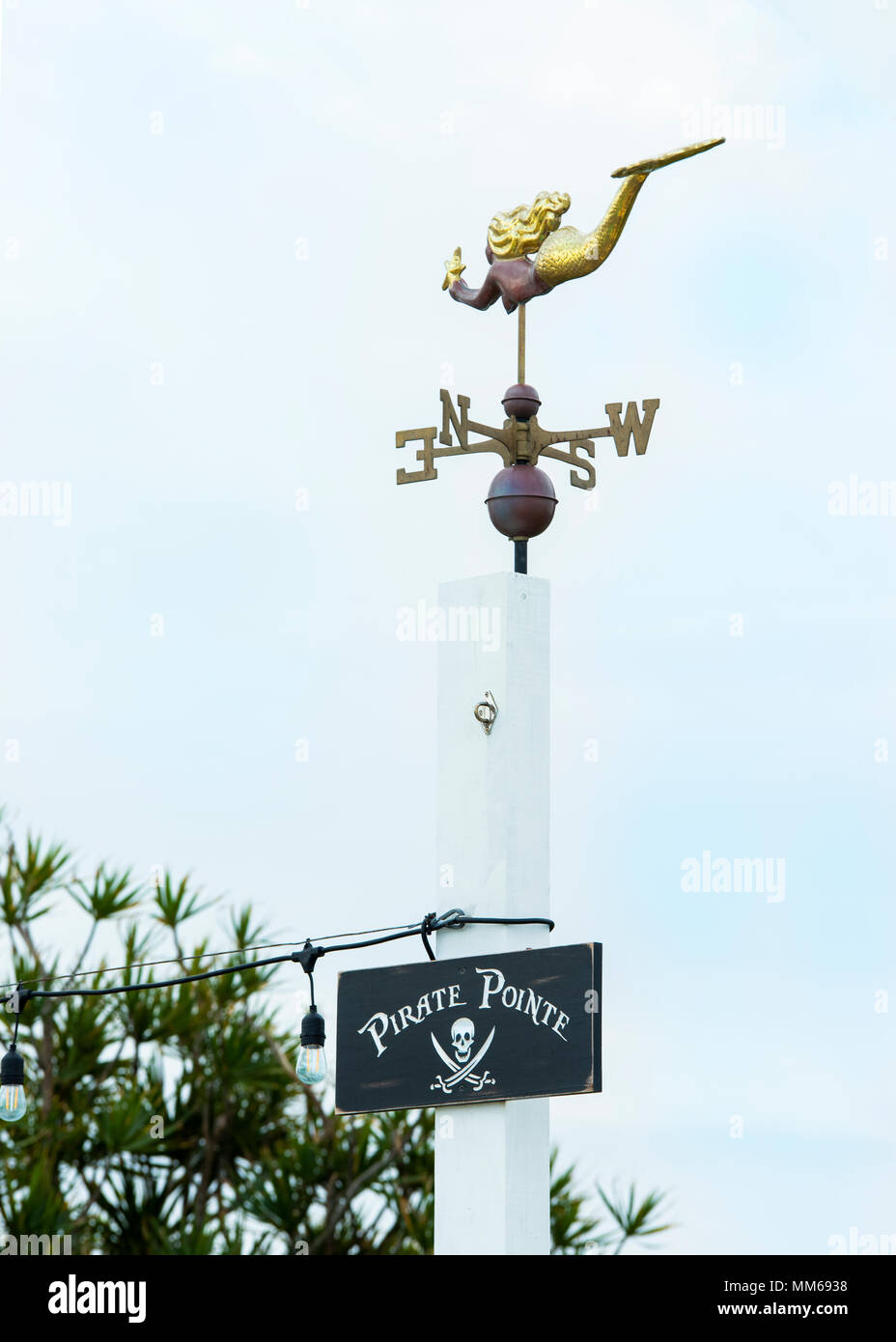 A mermaid weather vane on a pole Stock Photo - Alamy