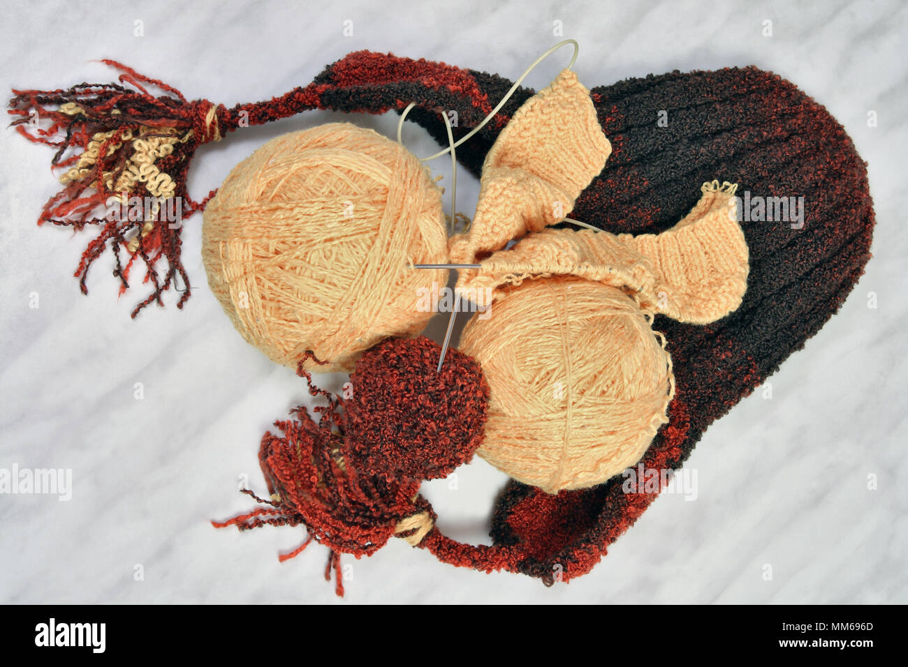 Knitting from wool by means of spokes.Finished product-children's hat ...