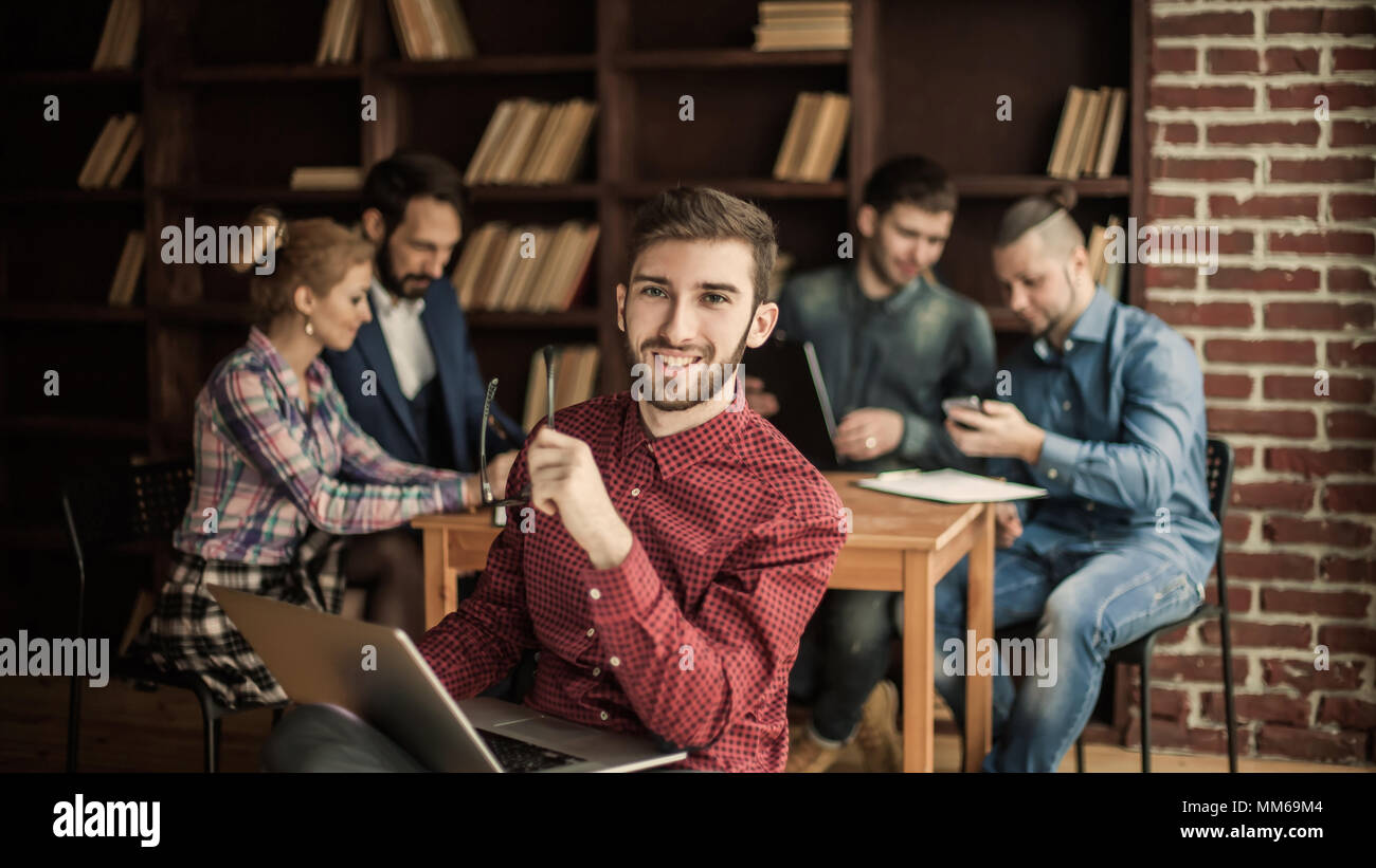 officer of the company with laptop on the background of business Stock ...