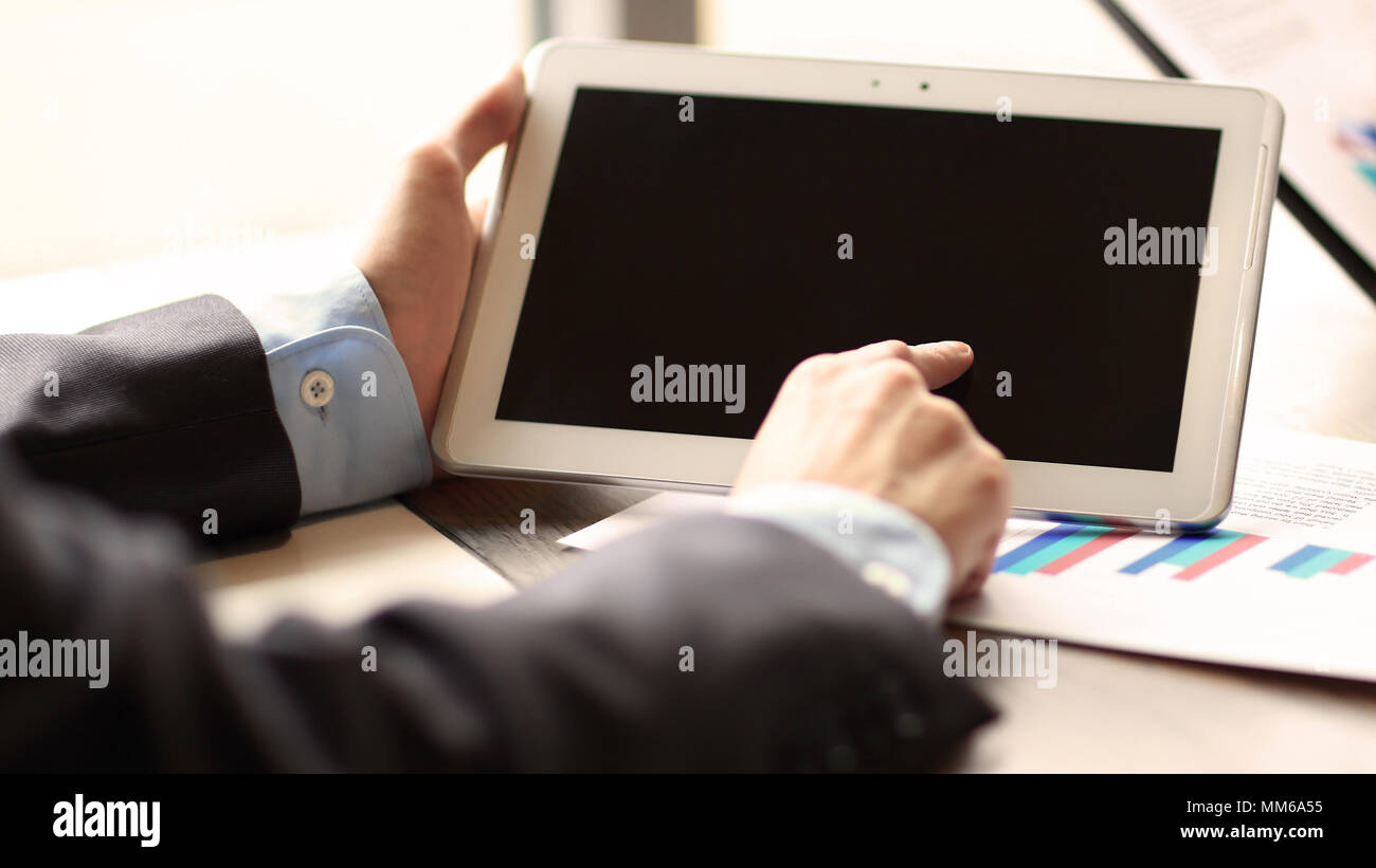 young businessmen using touchpad at meeting Stock Photo - Alamy