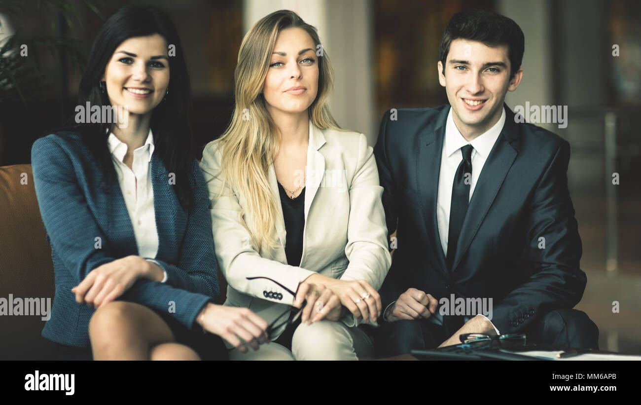 Portrait of a successful business team against a modern office ...