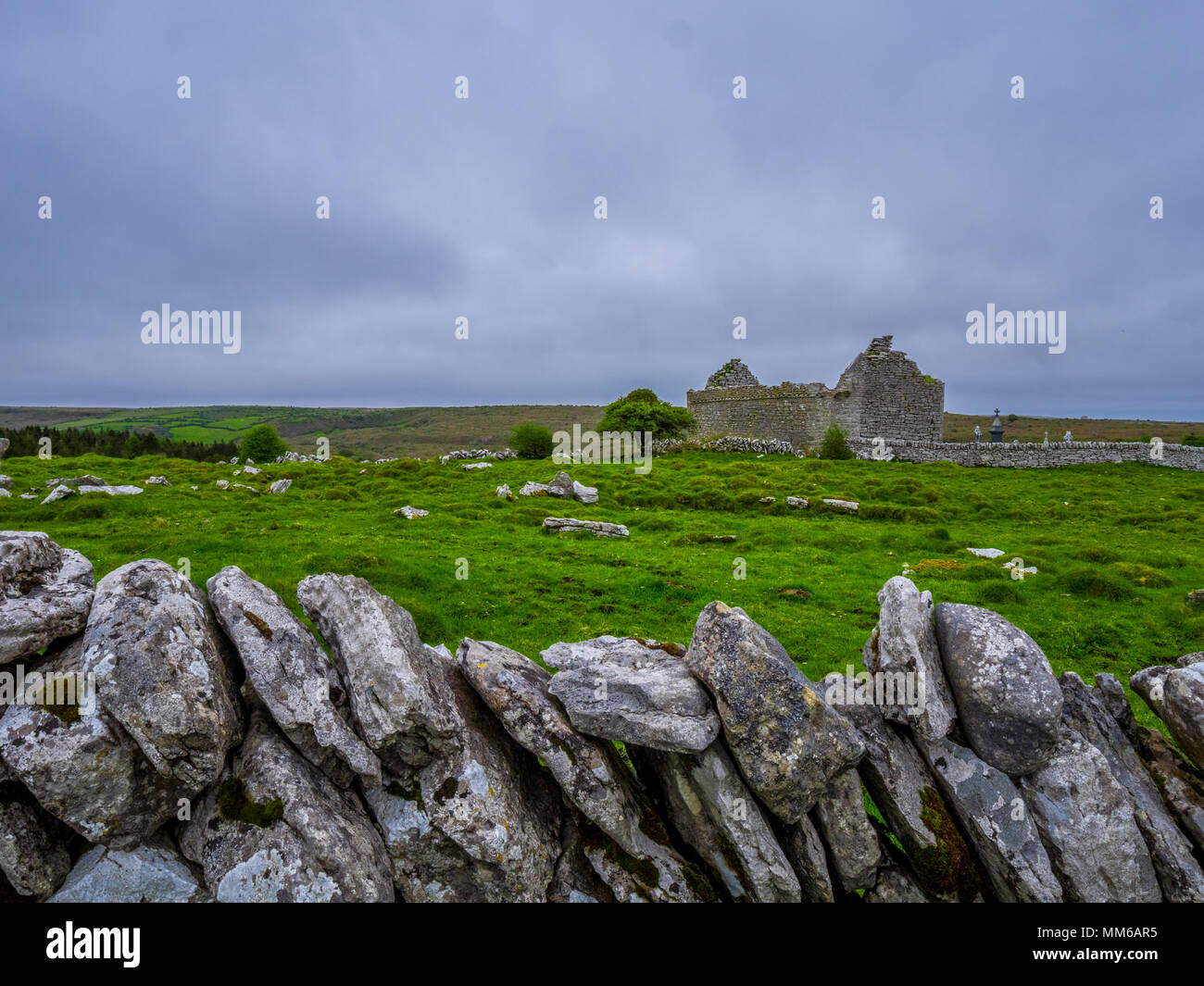 Stone wall and ancient church ruin in Ireland Stock Photo - Alamy
