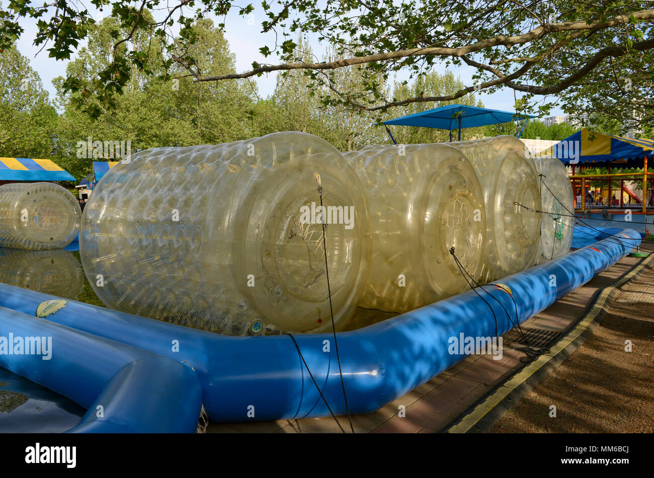 Inflatable pipes for children to play and walk across the water in ...