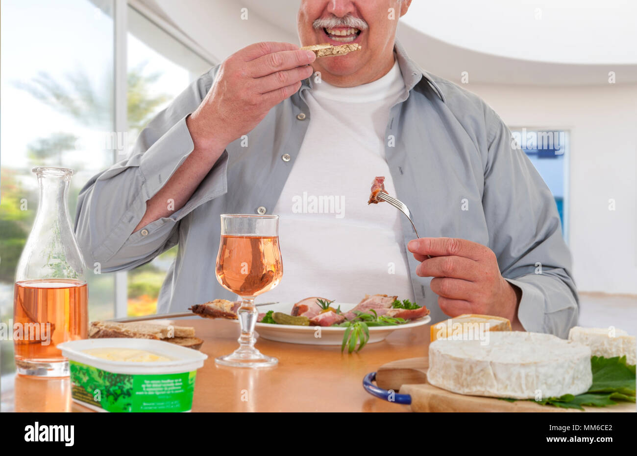 Old man eating bread hi-res stock photography and images - Alamy